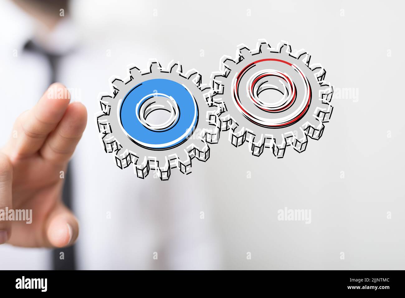 A male hand showing the illustration of the gear icon Stock Photo - Alamy