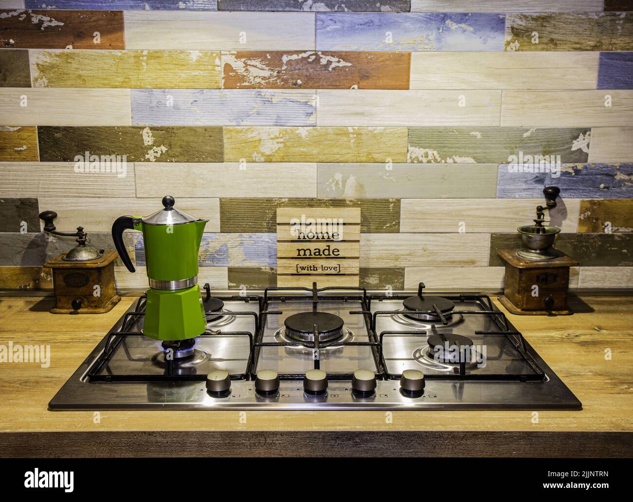 Italian moka coffe pot resting on stove top in house's kitchen Stock ...
