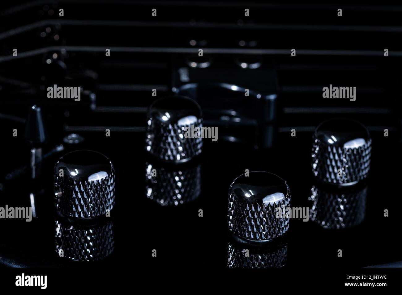 A closeup of bass guitar knobs and strings Stock Photo - Alamy