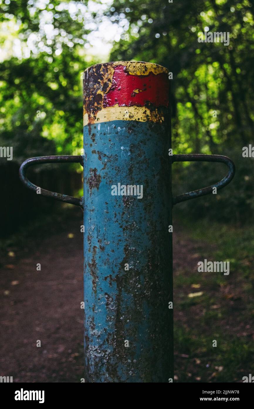 A vertical shot of a red, yellow and blue metal pole Stock Photo - Alamy