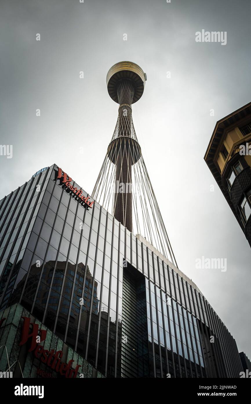 A low angle shot of the Sydney Tower Eye in Sydney, Australia with gray ...