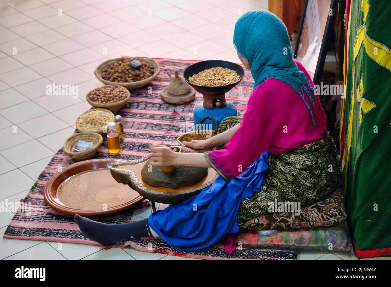 Artisan woman making argan oil in Morocco Stock Photo - Alamy
