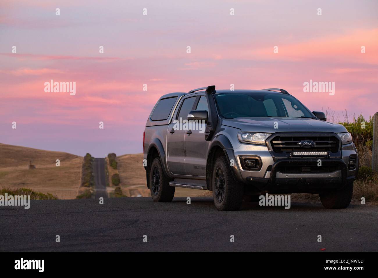 The 4x4 vehicle on country road at sunset. Port Fairy, Australia Stock ...