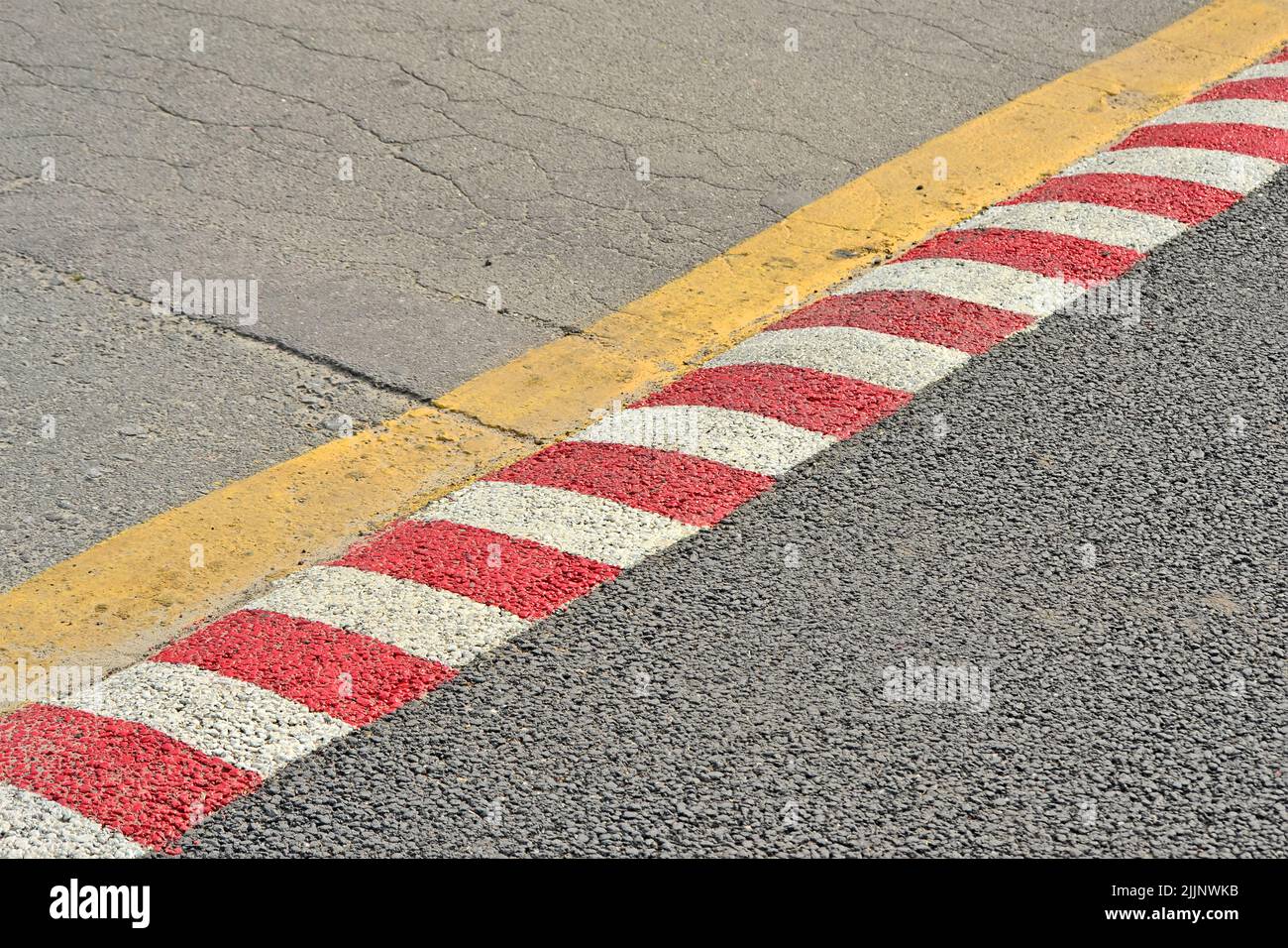 red barrier line on asphalt, striped line, security area diversity ...