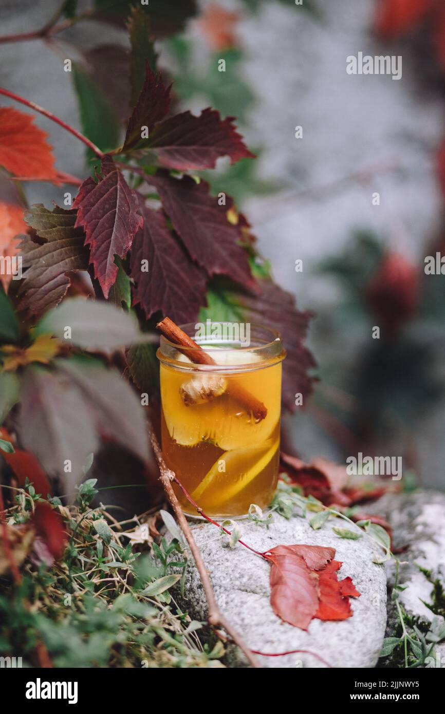 A hot pear drink with ginger lime and cinnamon wood Stock Photo - Alamy