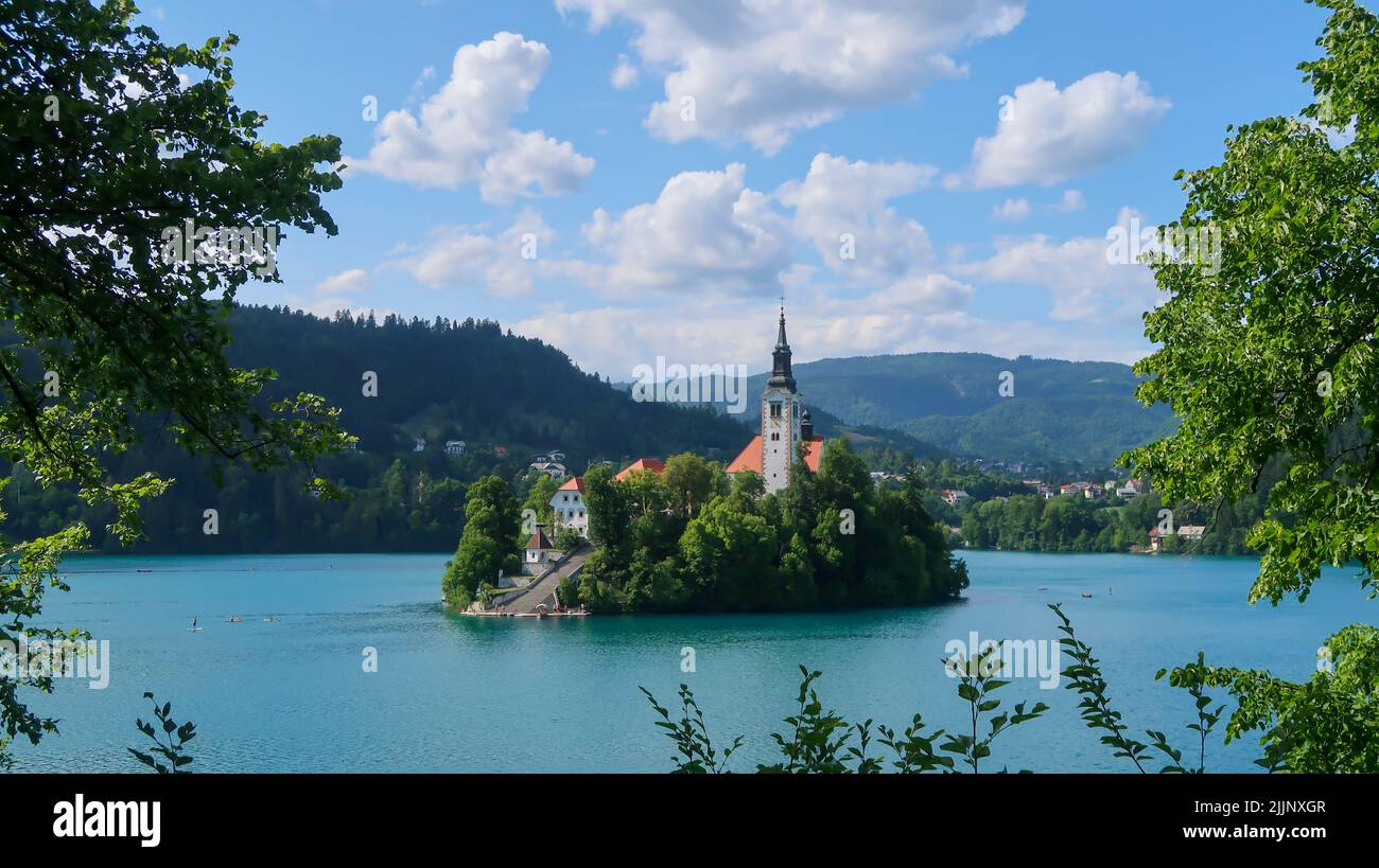 A natural view of Catholic church situated on an island on the Bled ...