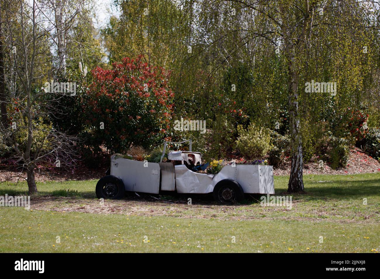 A beautiful shot of an old abandoned vehicle under the trees Stock ...