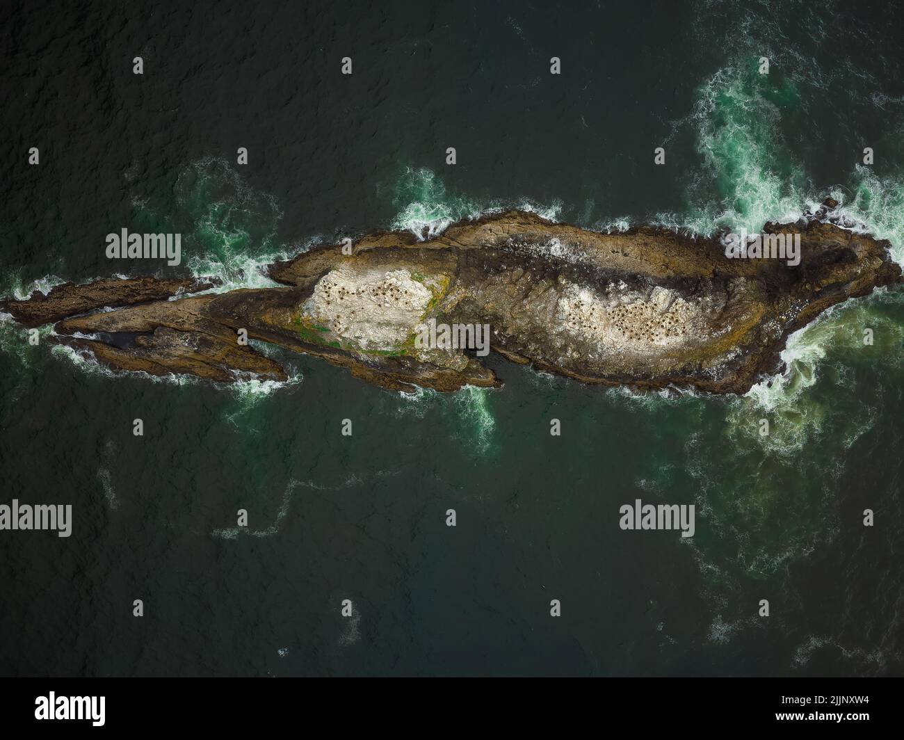Shooting from a drone. Stone island, bizarre shape, in the middle of ...