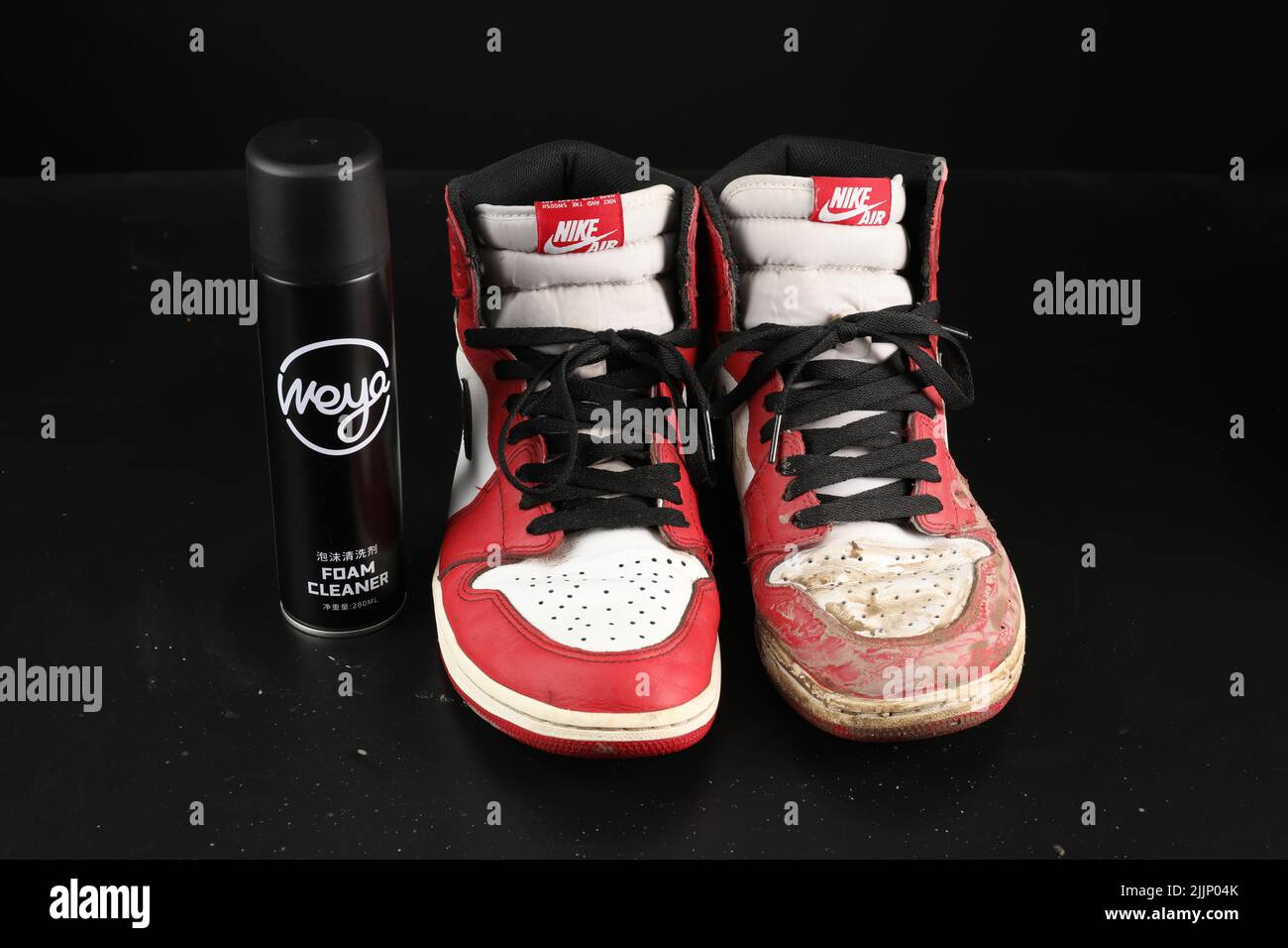 The close-up shot showing Sneaker Cleansing Foam and using way Stock ...