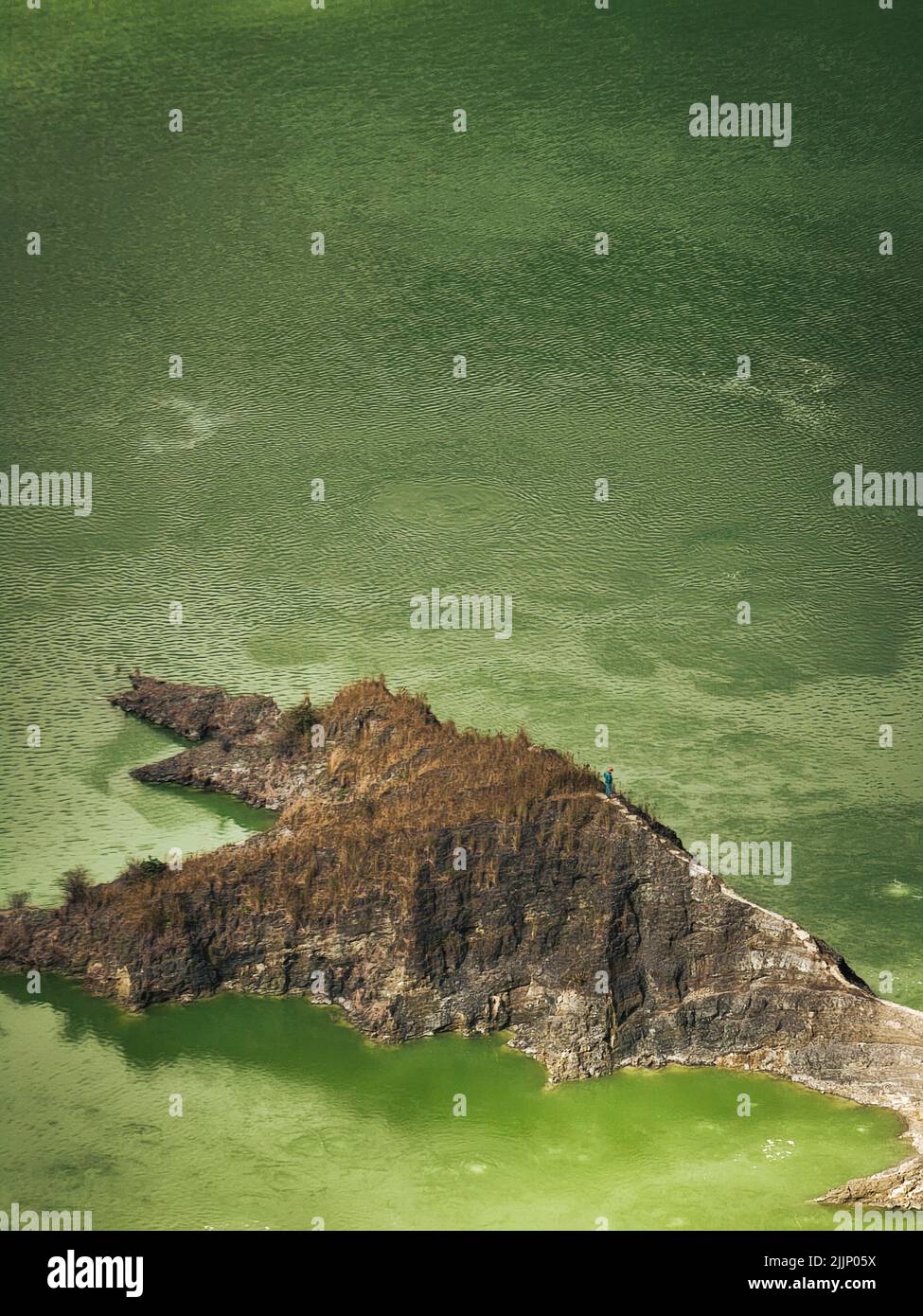 A small rocky island in the lake on Chichonal volcano, Chiapas, Mexico ...