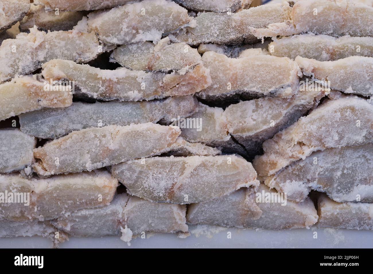 Stack of salted cod fillets on the counter of a local bazaar Stock ...