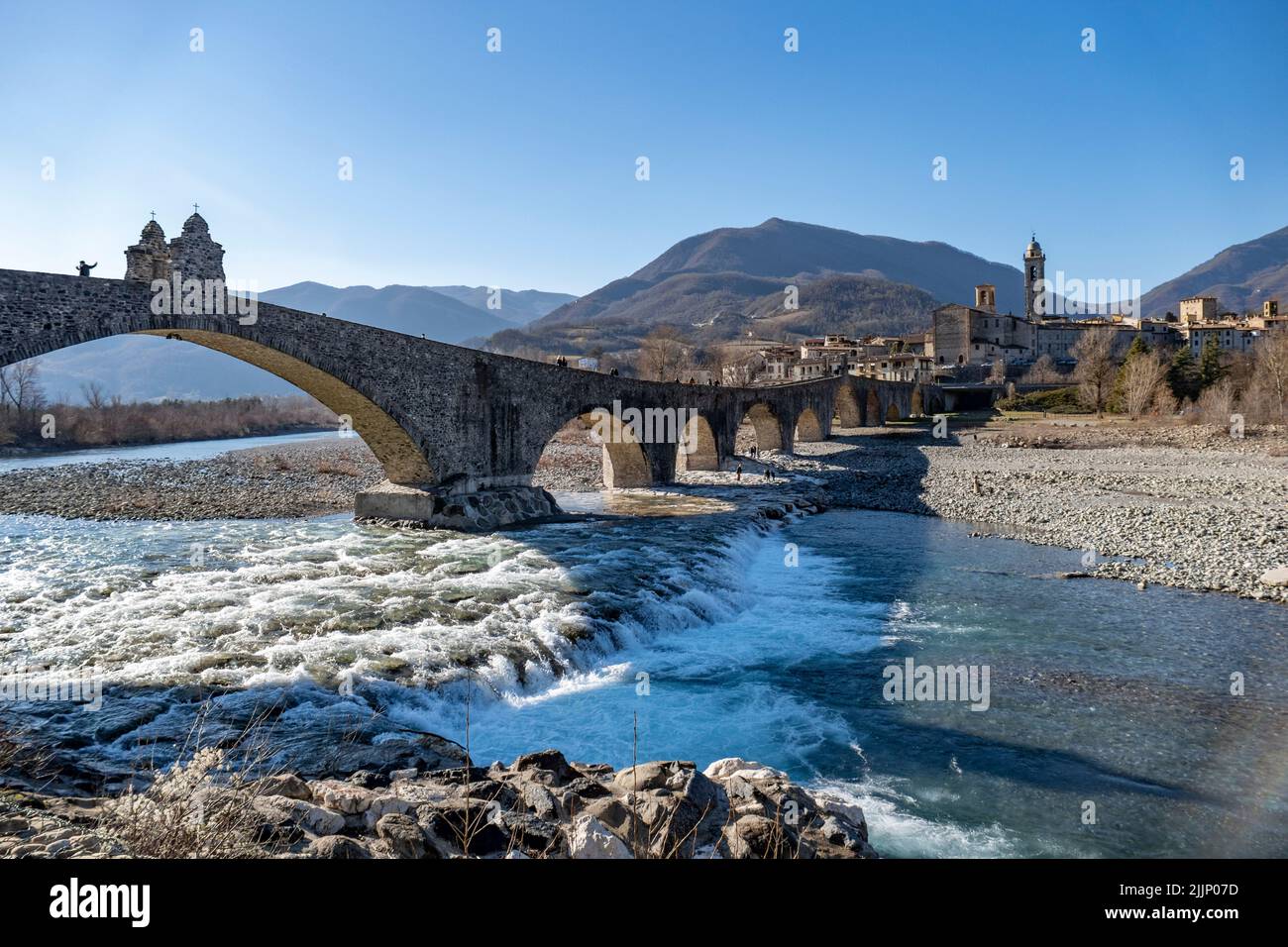 The Ponte Gobbo bridge with ancient buildings surrounded by the ...