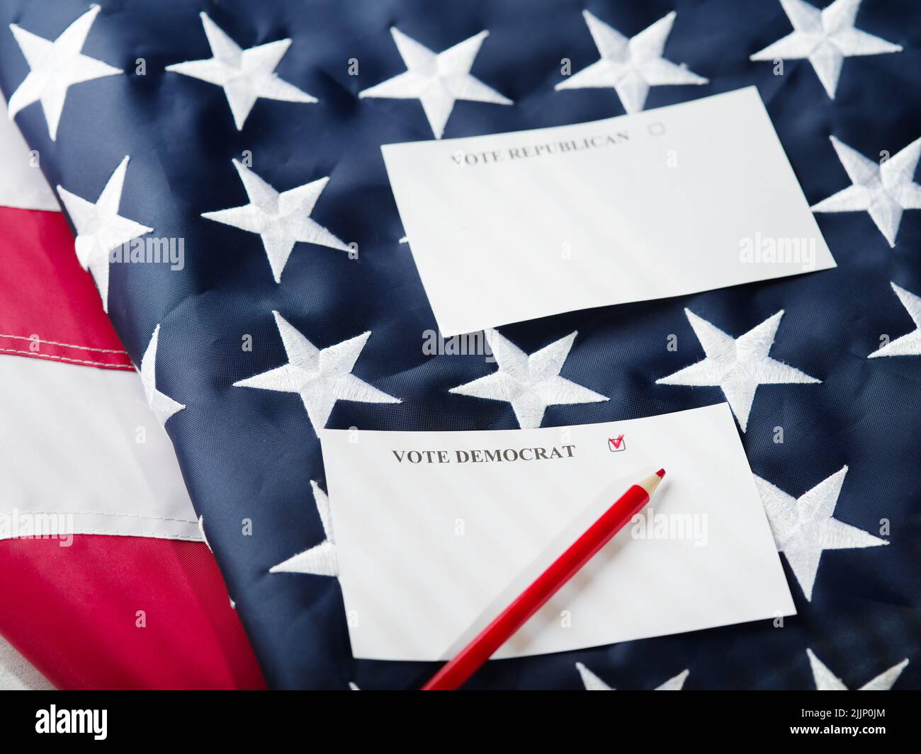 Two sheets of paper and a red pencil. Captions - Vote Democrat, Vote ...