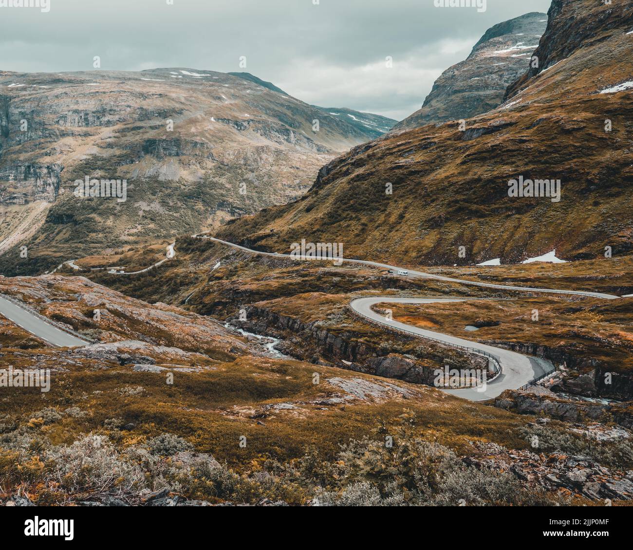 A beautiful road in a natural place between mountains Stock Photo - Alamy