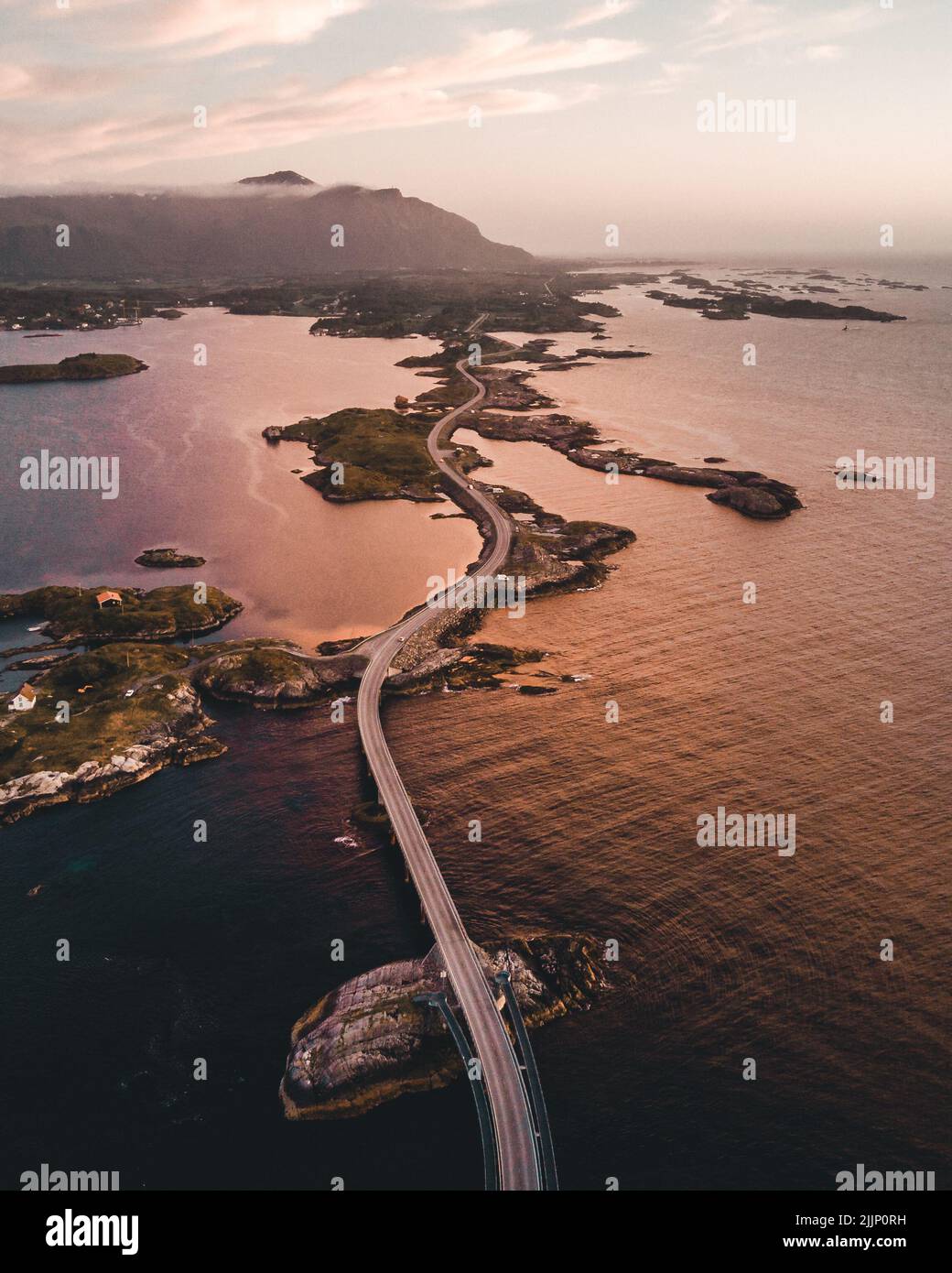 vertical shot of long road going through small islands in ocean Stock ...