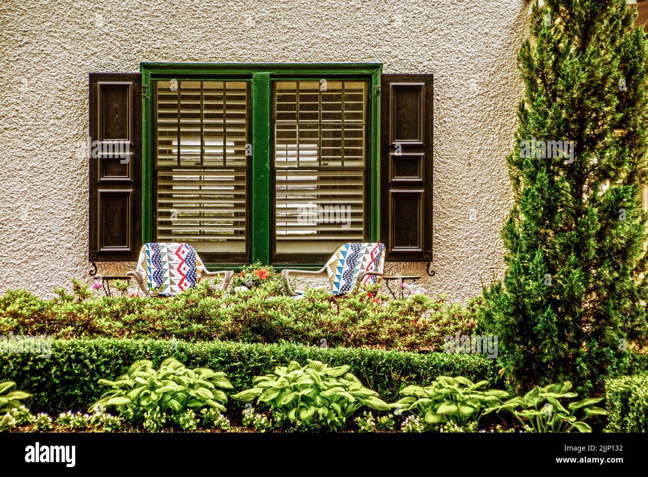 Outdoor conversation sitting area patio furniture in front of shuttered ...