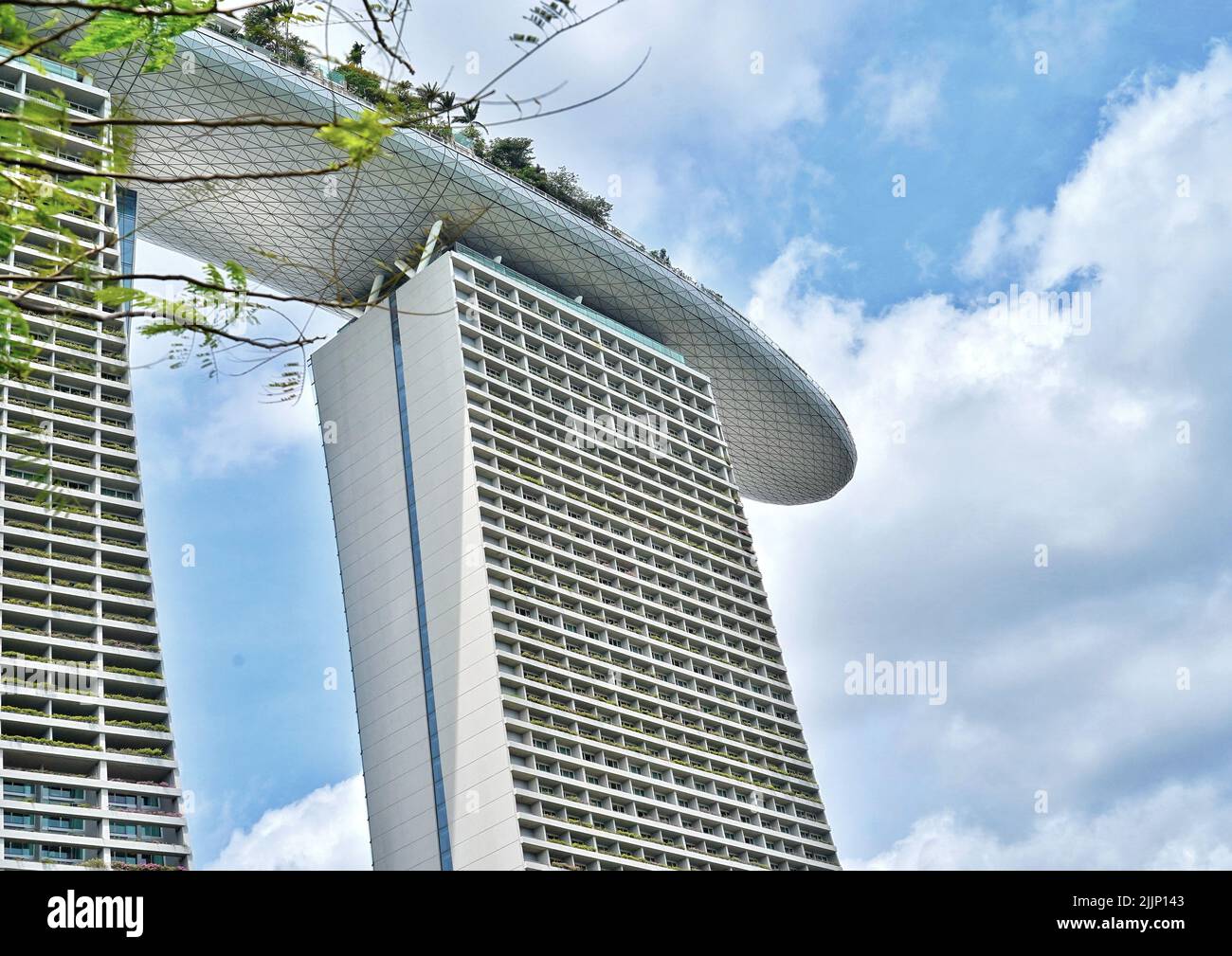 A low angle shot of the famous Marina Bay Sands hotel under a bright ...