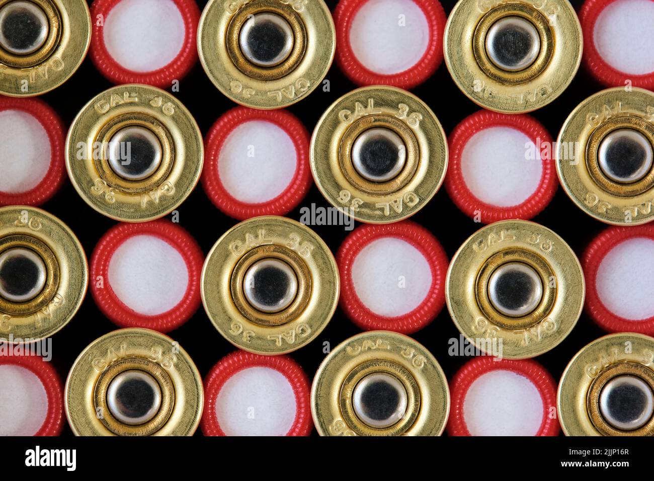 Closeup background of bunch of shotgun shells of 36 caliber paced in ...