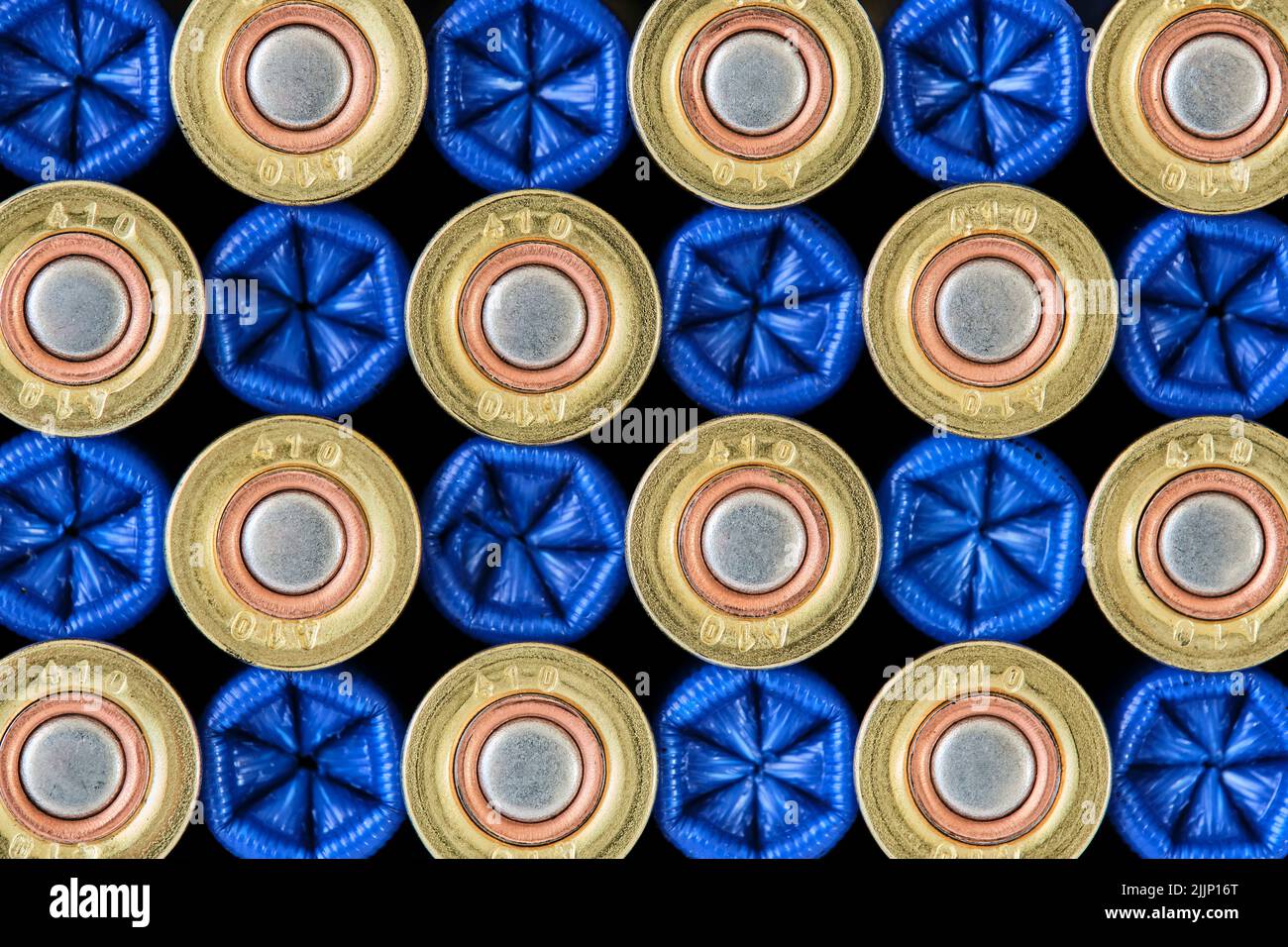 Closeup background of many blue plastic shells for shotgun arranged in ...