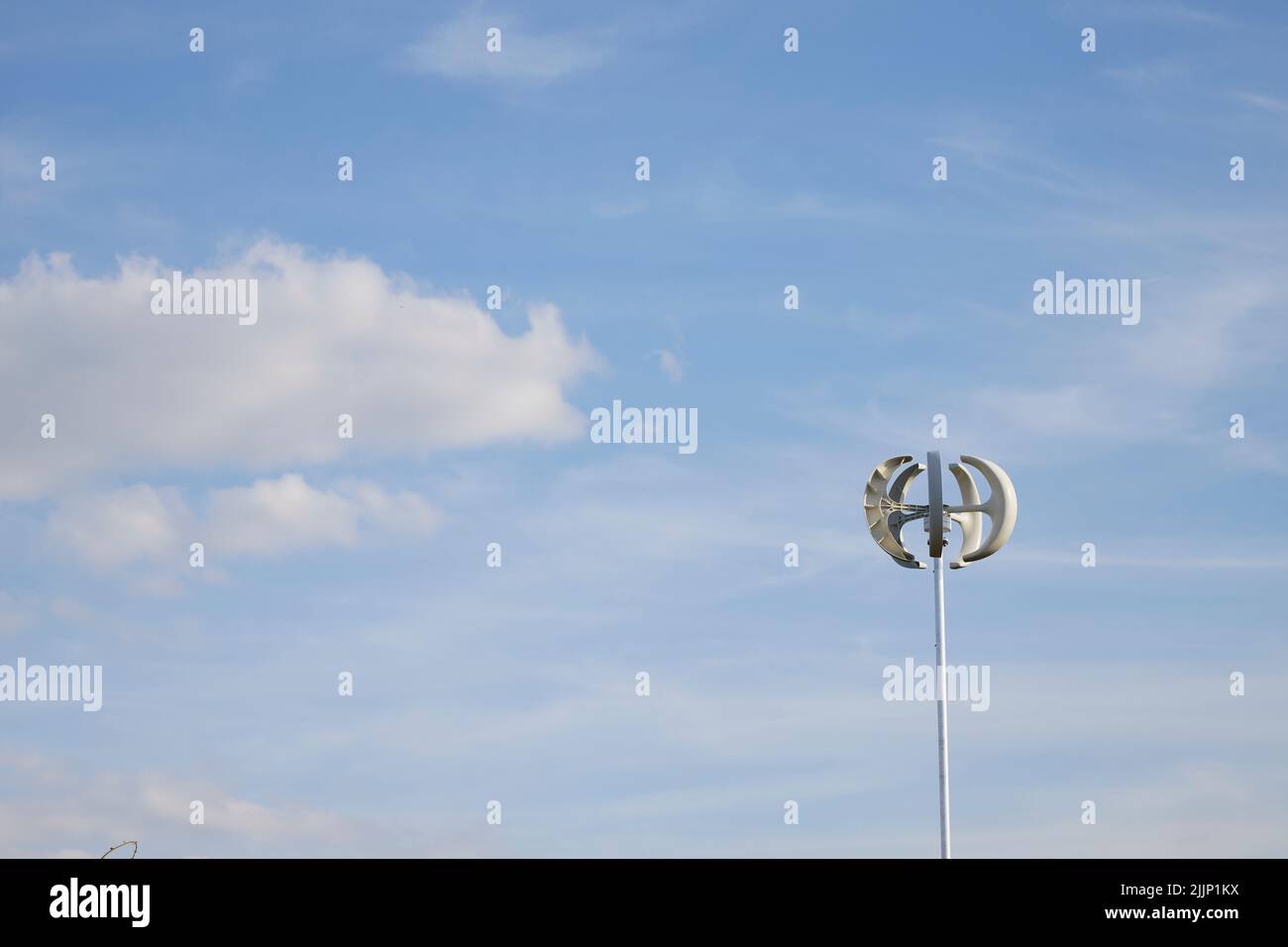small modern wind mill, alternative energy Stock Photo - Alamy