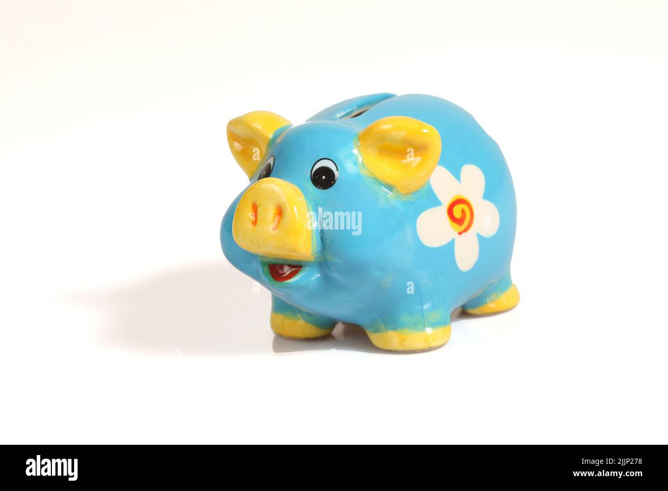 A blue and yellow piggy bank isolated on a white background Stock Photo ...
