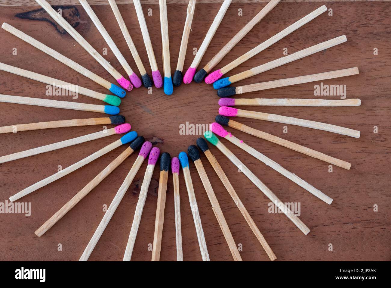 Colourful matchsticks in the shape of a heart Stock Photo - Alamy