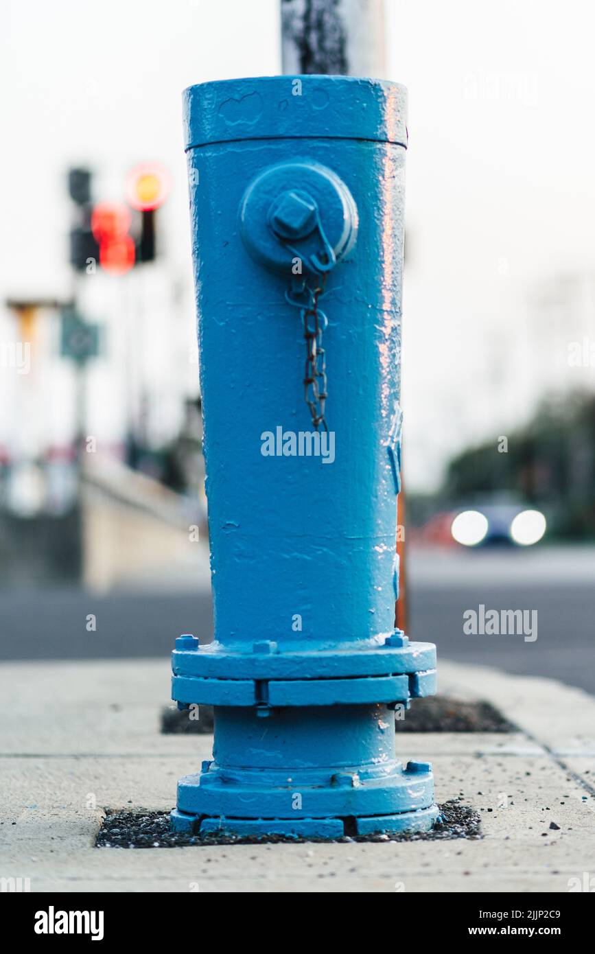 A blue Fire Hydrant On Footpath In City Stock Photo - Alamy