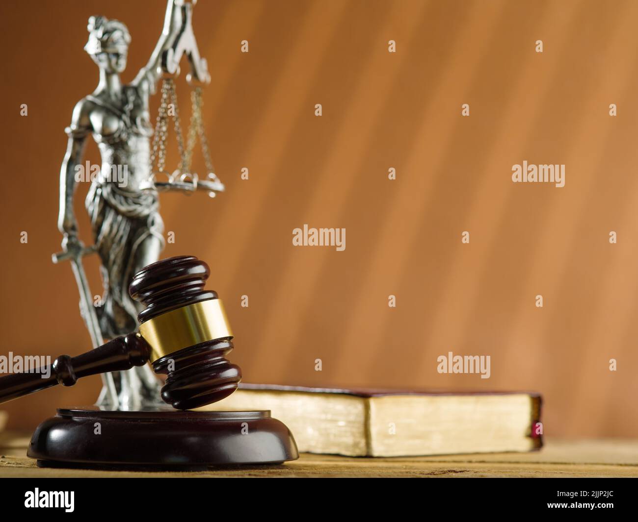 Symbols of a fair trial. On a beige background is a bronze figurine of ...