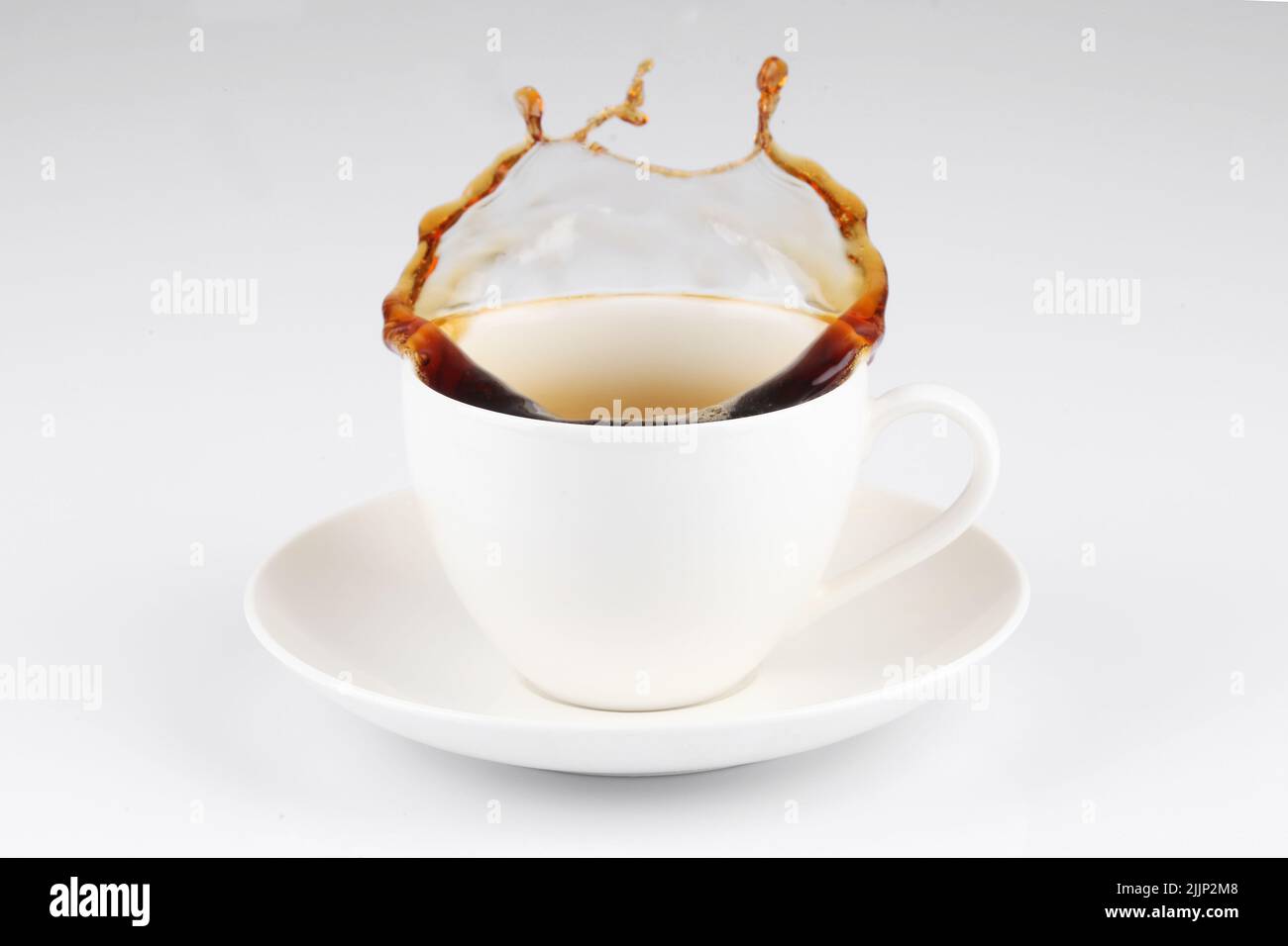 A coffee splashing out of a cup isolated on white background Stock ...