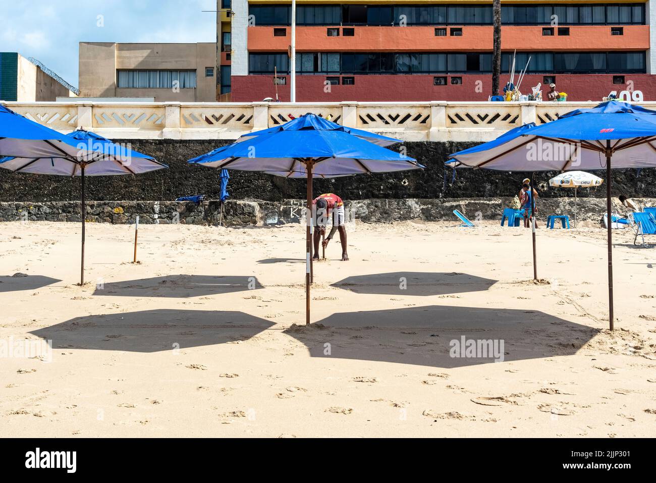 Blue umbrellas at Farol da Barra beach in Salvador, Bahia, Brazil Stock ...