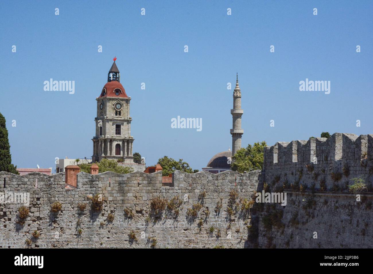 Mosque of Suleiman next to the medieval clock tower in the city of ...