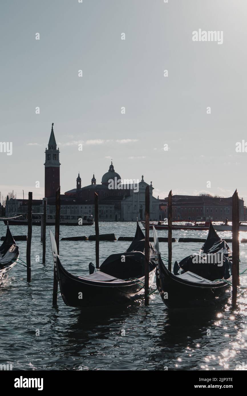 A vertical shot of traditional gondolas in Venice, Italy Stock Photo ...