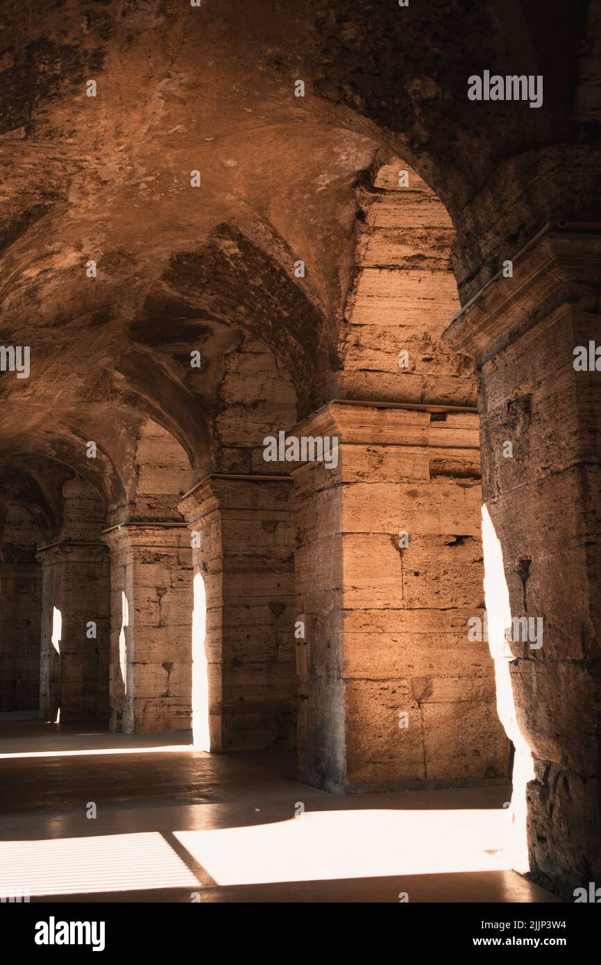 A vertical shot of columns of the Colosseum, Rome Stock Photo - Alamy