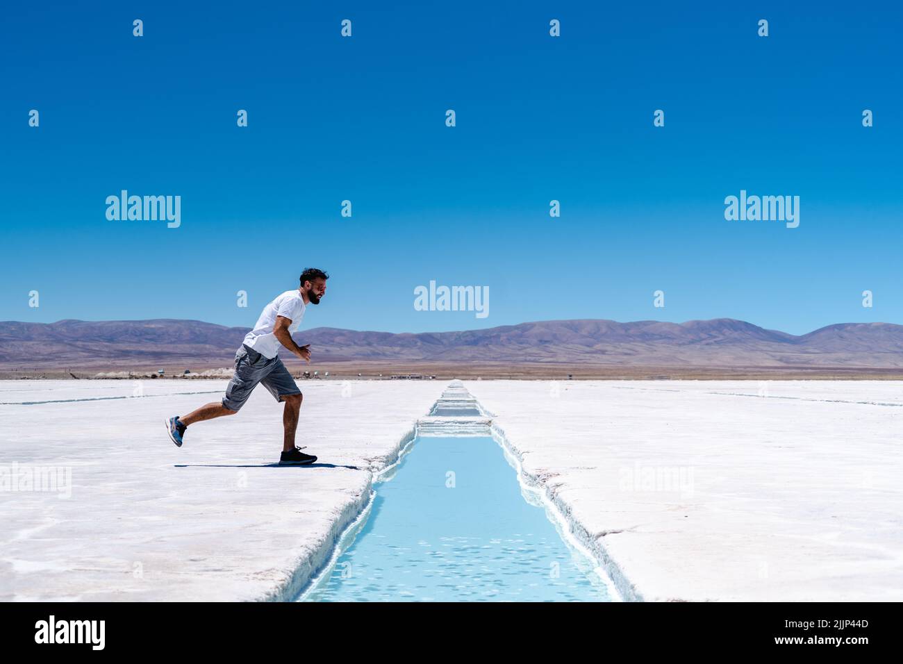 Man jumping into the water hi-res stock photography and images - Alamy