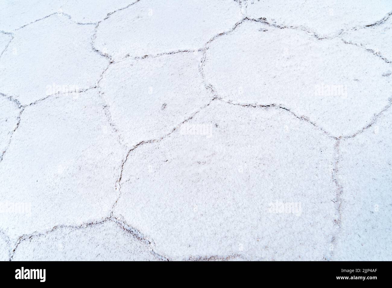 A top view of an ice with cracks covered with snow Stock Photo - Alamy