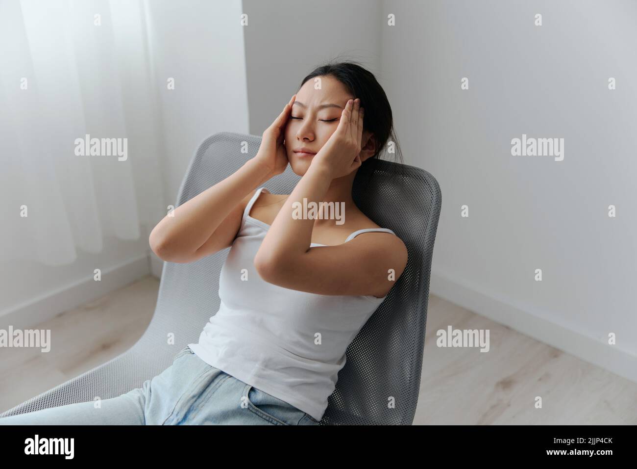 Panic attack. Frustrated suffering tanned beautiful young Asian woman ...