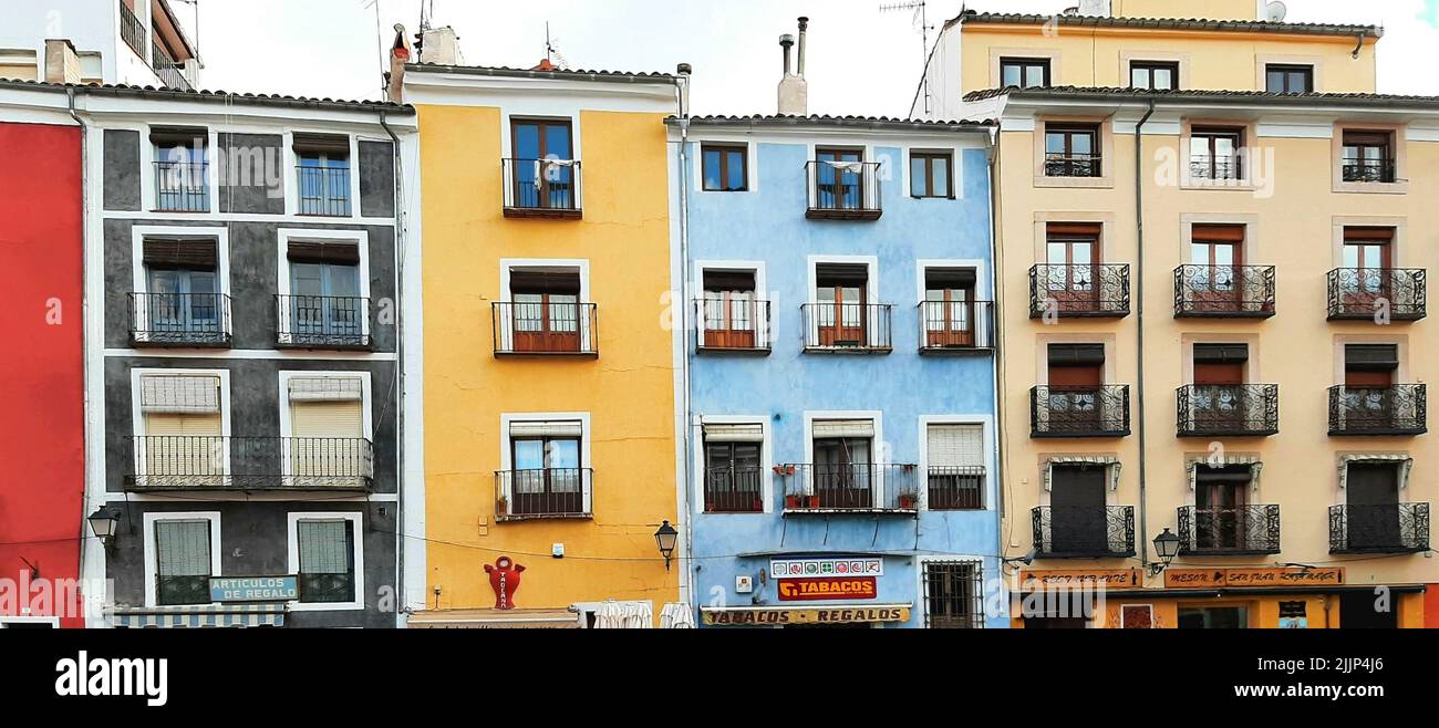 The facade of colorful residential buildings in Cuenca, Spain Stock ...