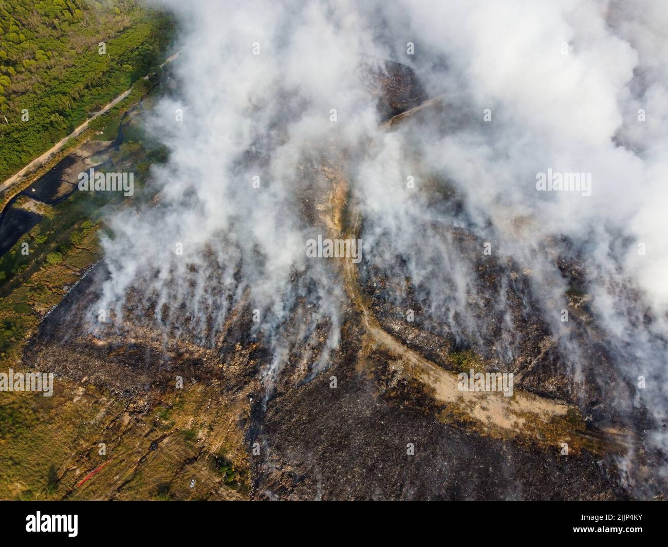 An aerial view of a landfill site on fire Stock Photo - Alamy