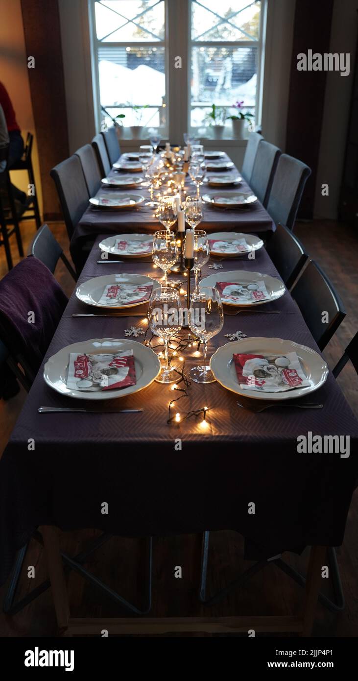 A view of christmas table with lights in the room Stock Photo - Alamy