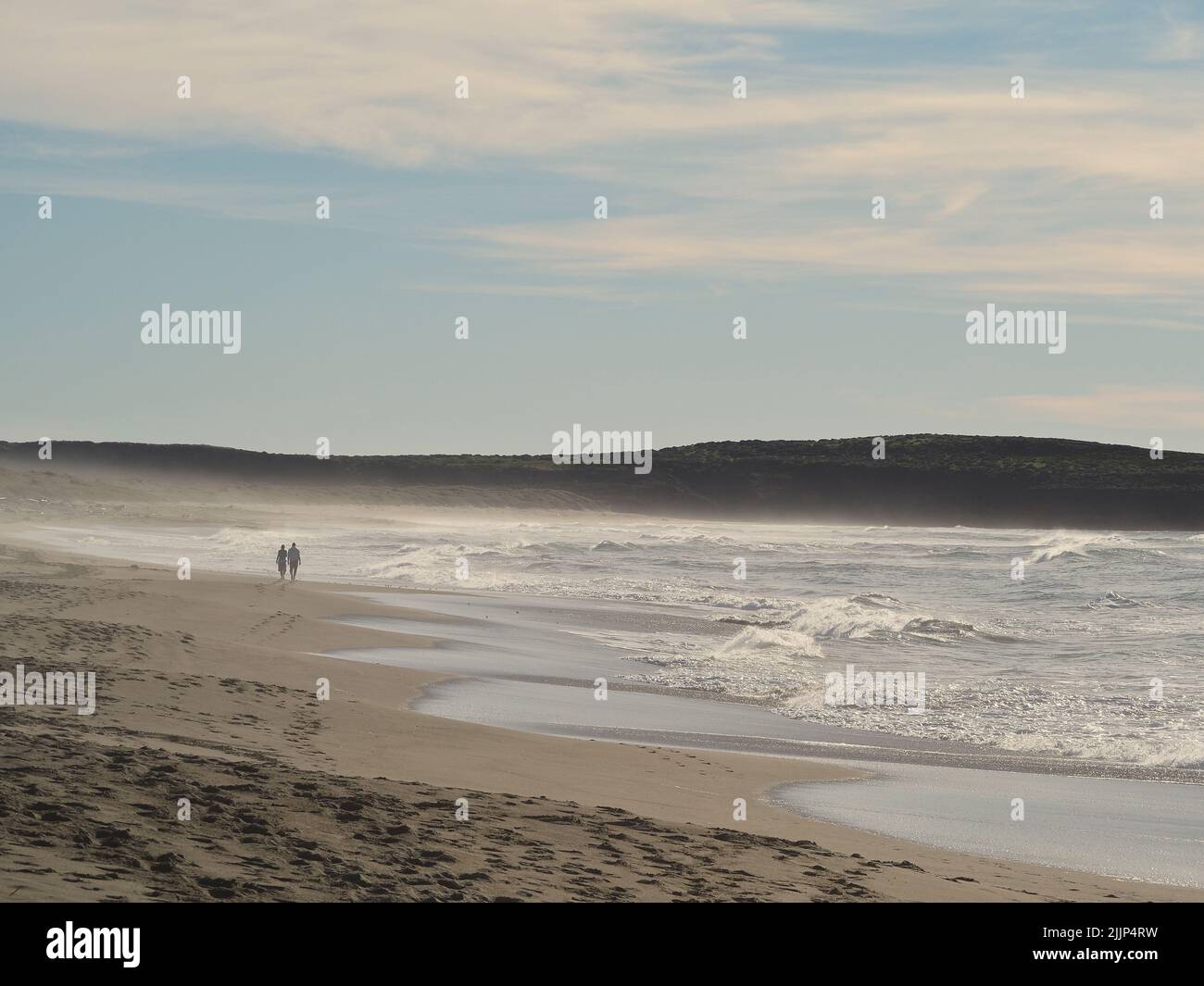 Distant people walking on a beach hi-res stock photography and images ...