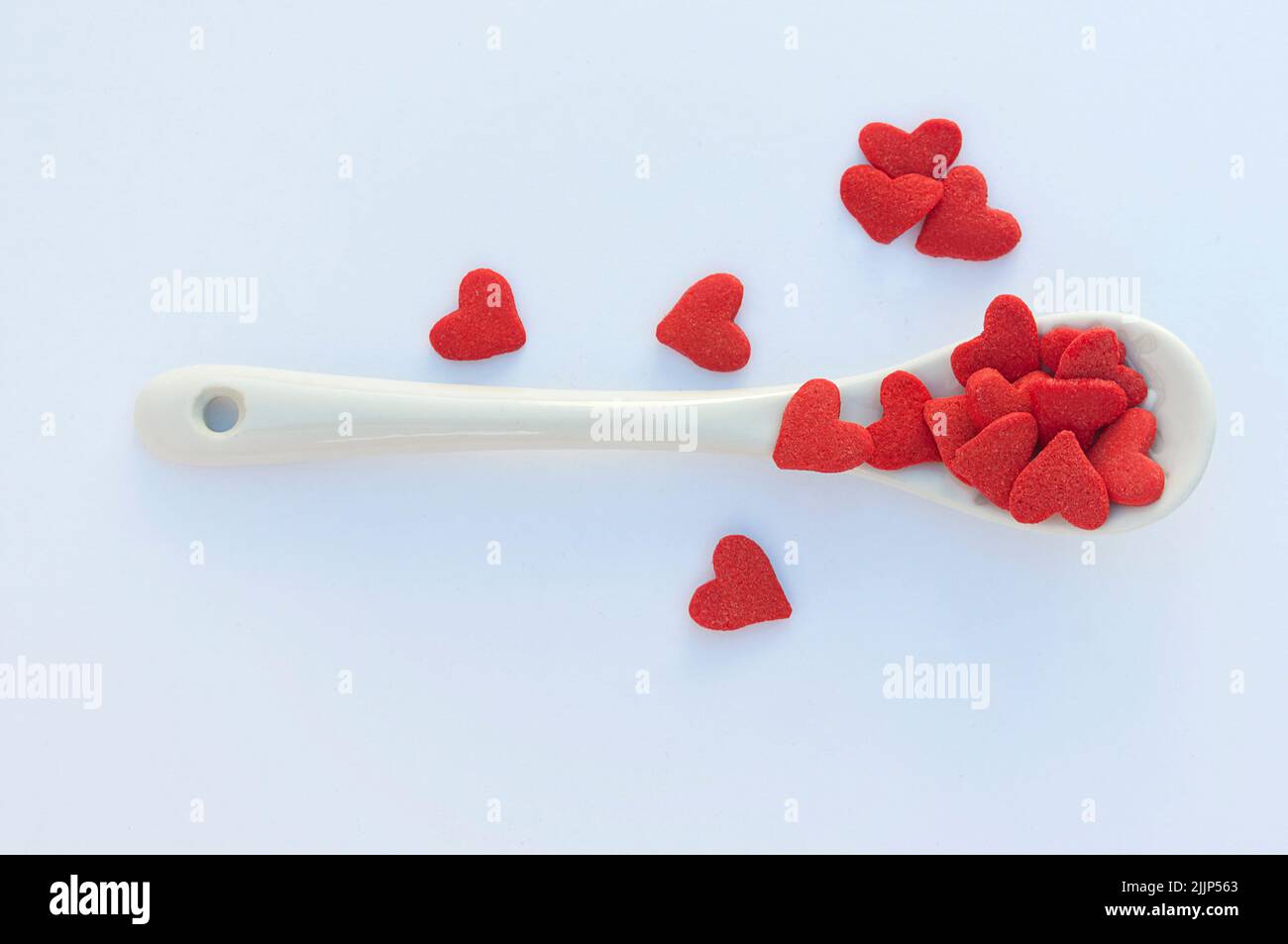 Heart shape red sprinkles falling hi-res stock photography and images ...