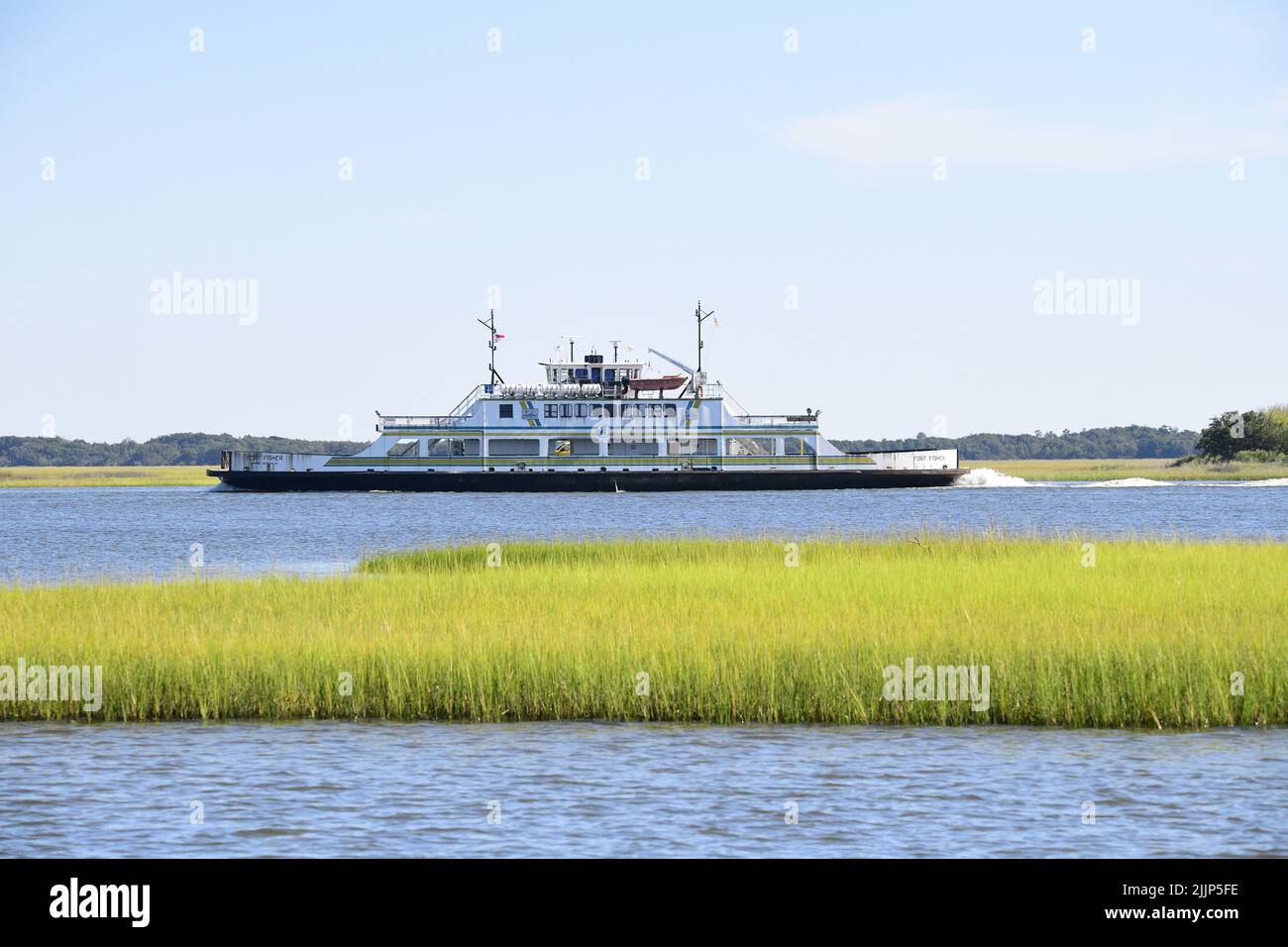 A beautiful view of a Fort Fisher Ferry in North Carolina ferry, marsh ...