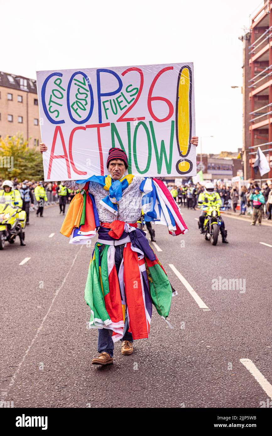 A man holding climate change poster at cop26 in Glasgow, United Kingdom ...