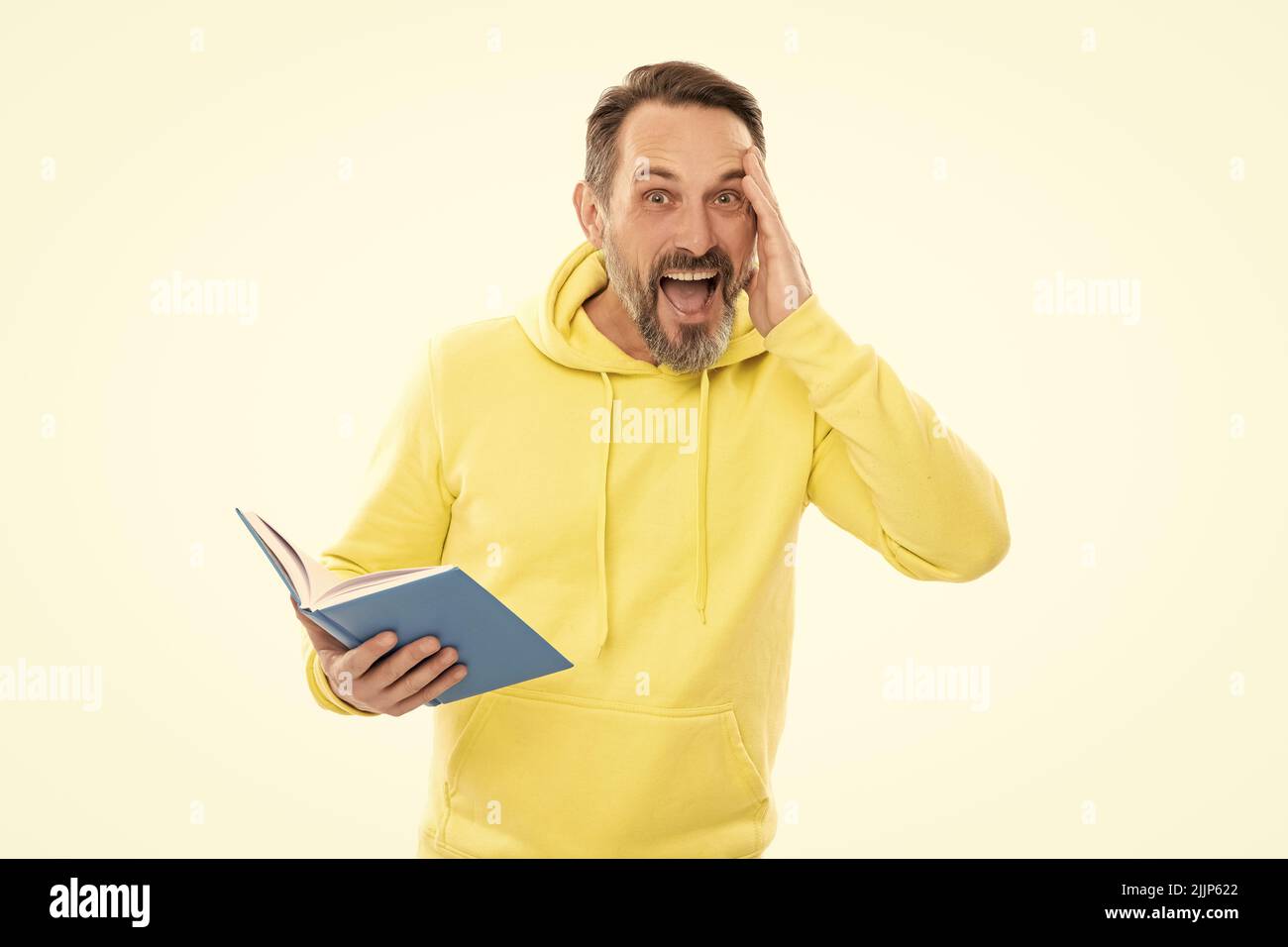surprised mature man hold book or notebook for education and reading ...