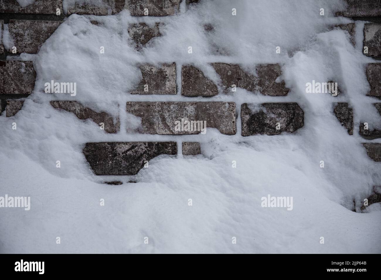 closeup photo of brick wall covered with snow Stock Photo - Alamy