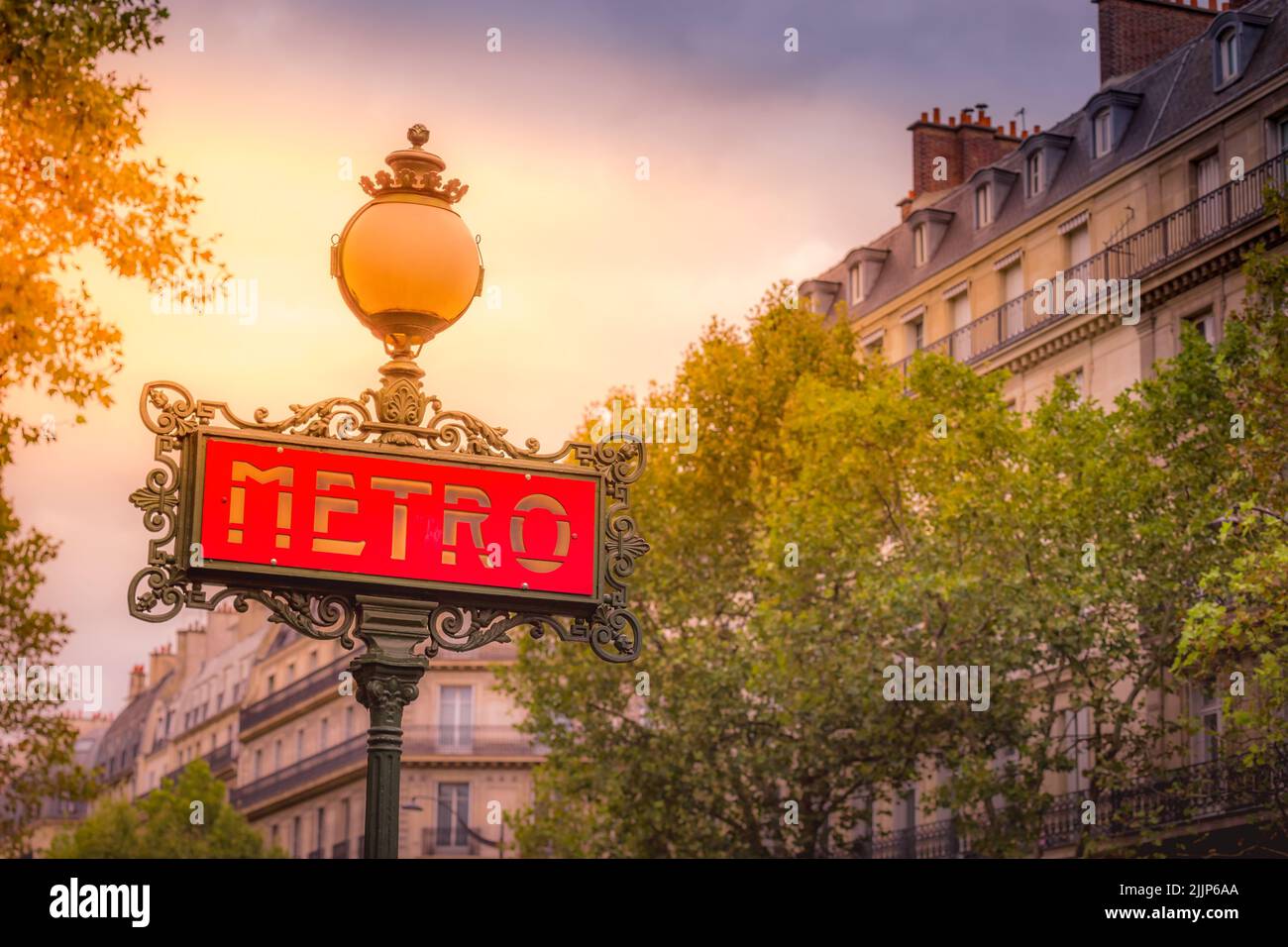 Retro Paris Metro sign entrance in Montmartre, Paris at sunset, France ...
