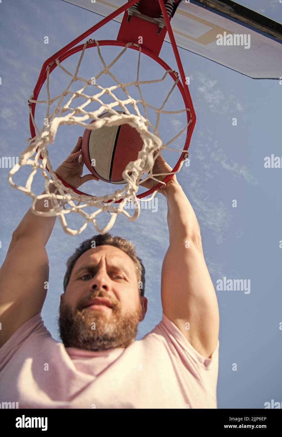 summer activity. man with basketball ball on court. professional ...