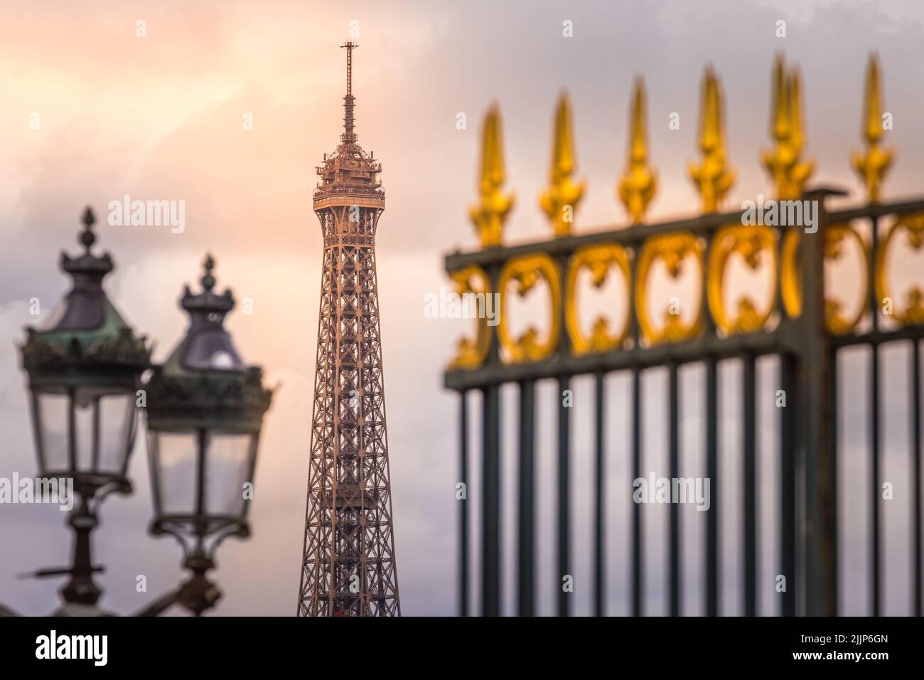 Eiffel tower framed by Place de la Concorde golden gates, Paris, France ...