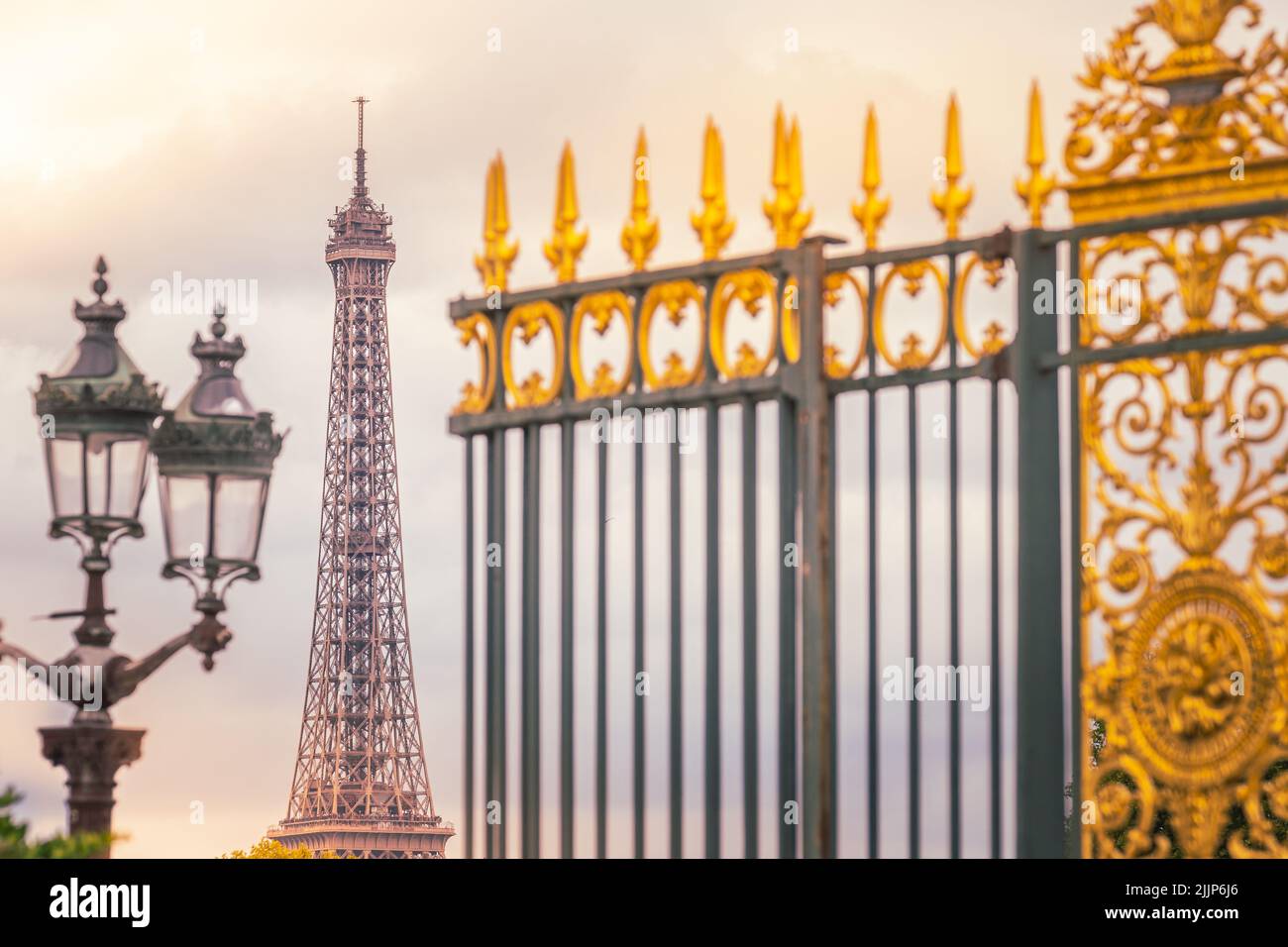 Eiffel tower framed by Place de la Concorde golden gates, Paris, France ...