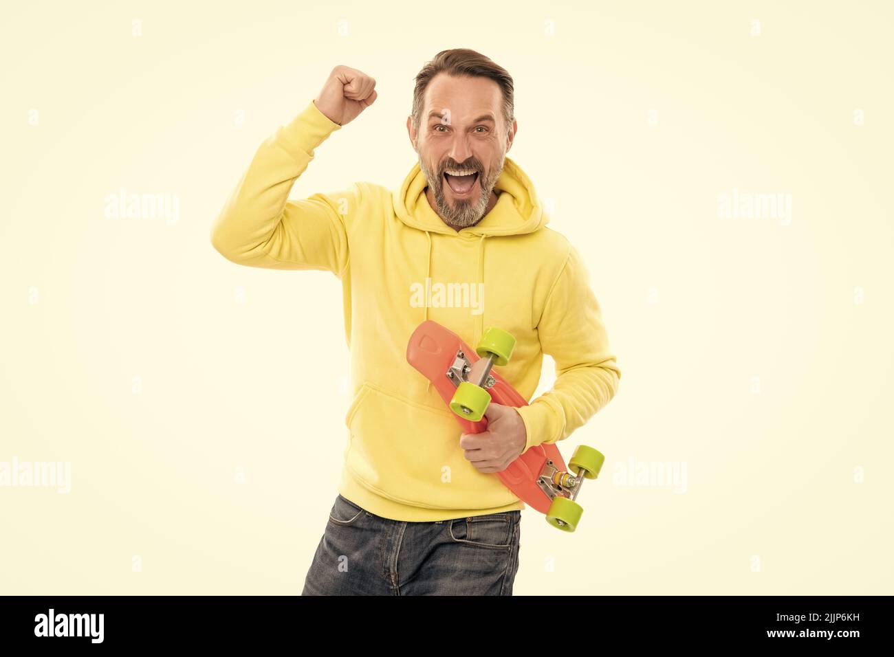 skateboarding. mature happy man with penny board. smiling senior guy ...
